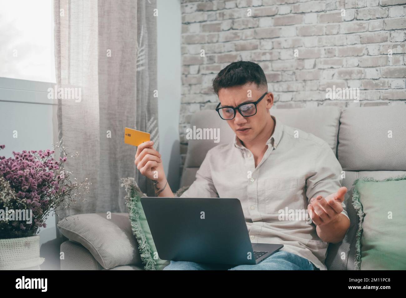Angry boy on sofa hi-res stock photography and images - Alamy