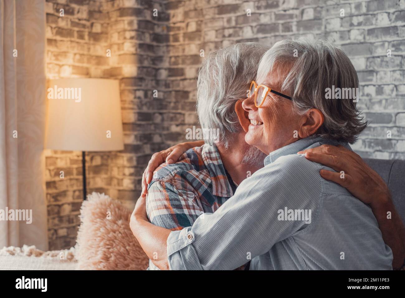Couple of two seniors hug together having fun and taking care each ...