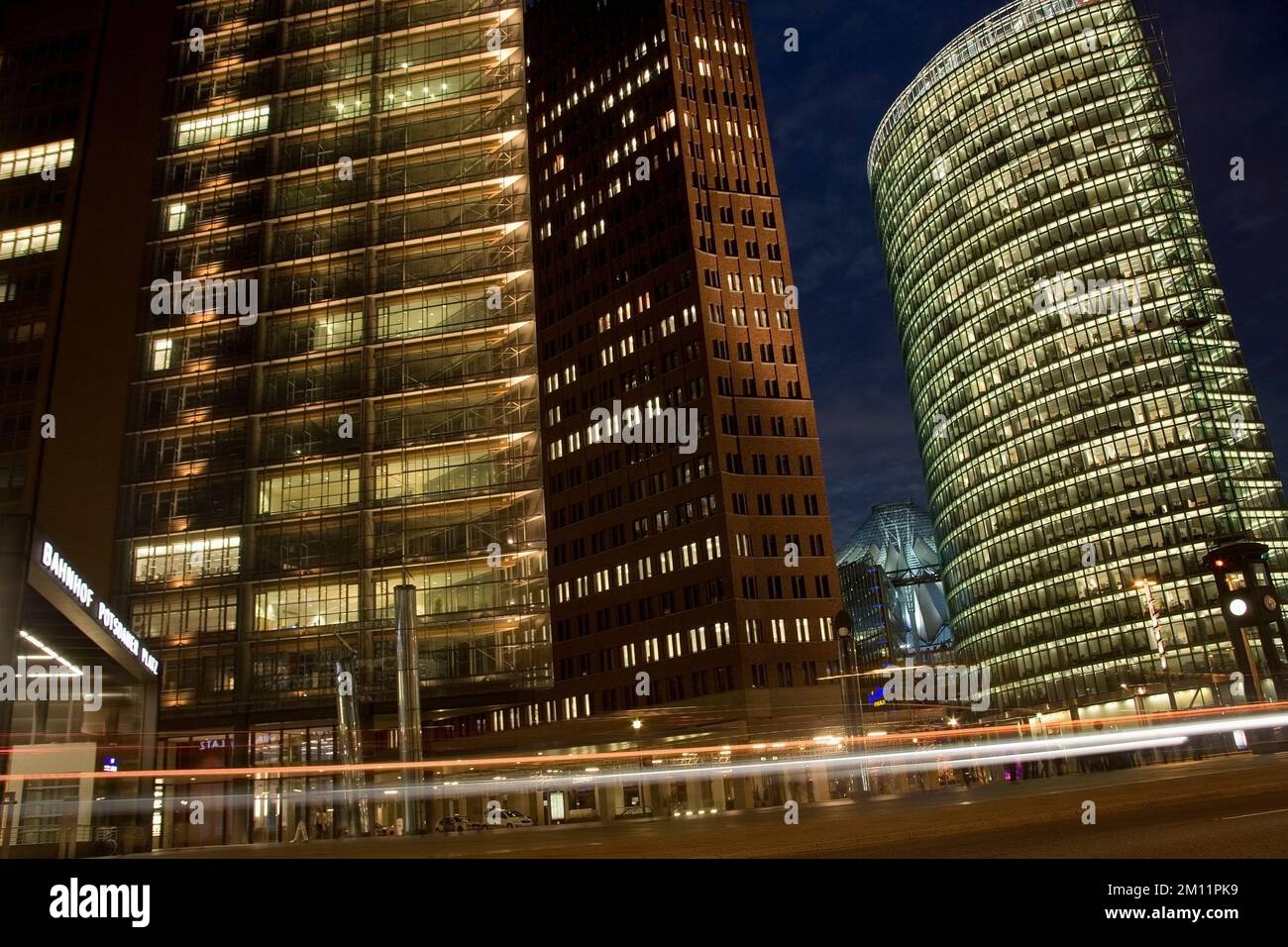 Modern buildings illuminated at night in Potsdamer Platz in the city of ...