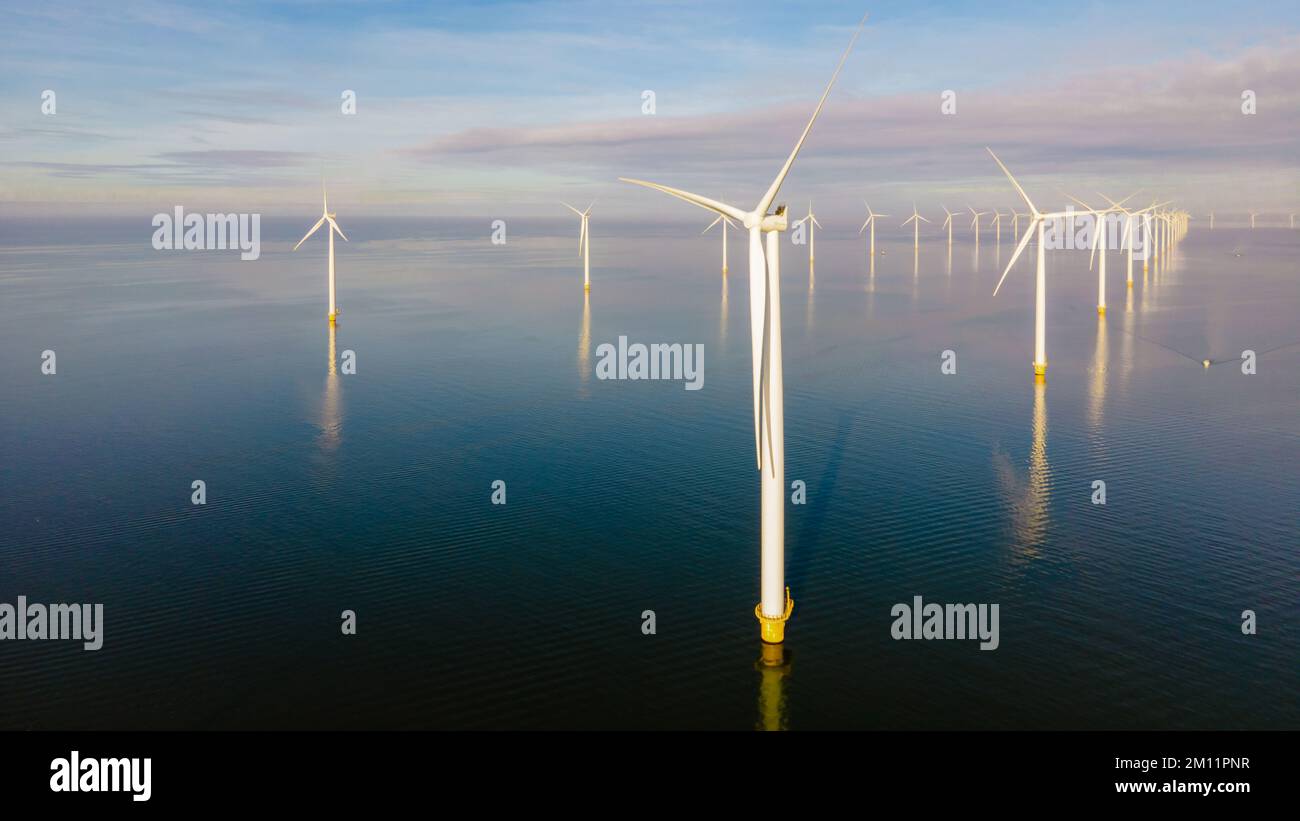Aerial view at Windmill park with wind mill turbines generating ...