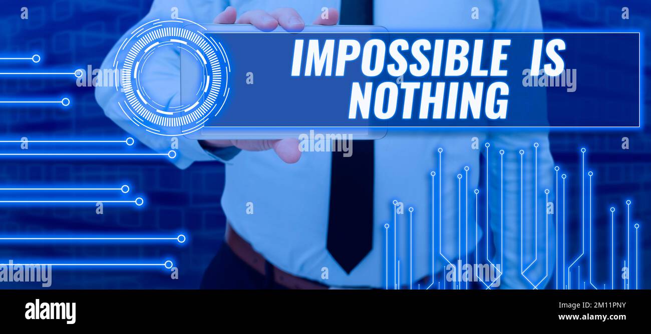 Text sign showing Impossible Is Nothing. Word Written on Something ...