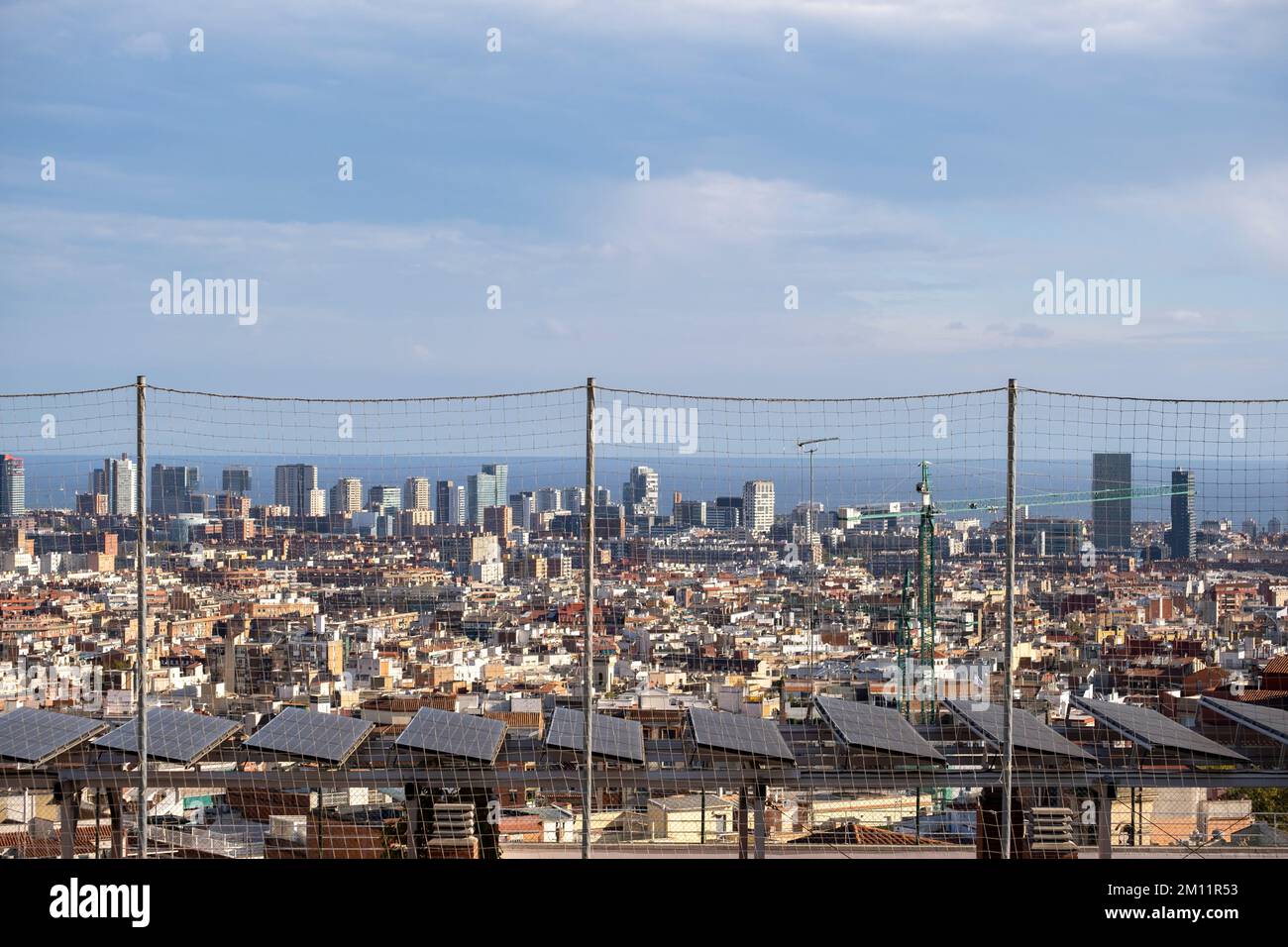 Solar cells and in the background an aerial view of the city of ...