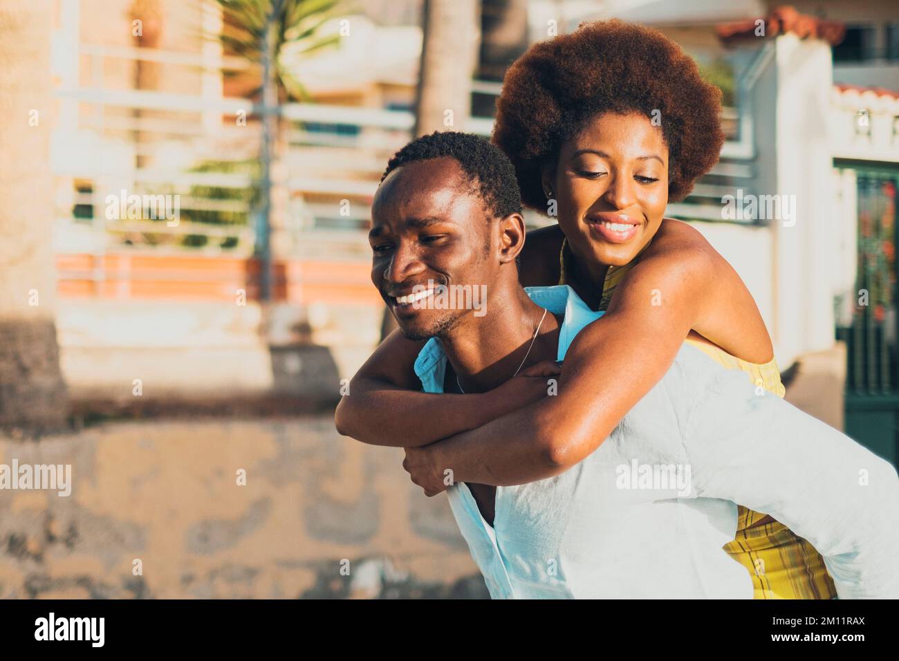 Happy black people couple with young man and woman having fun together ...