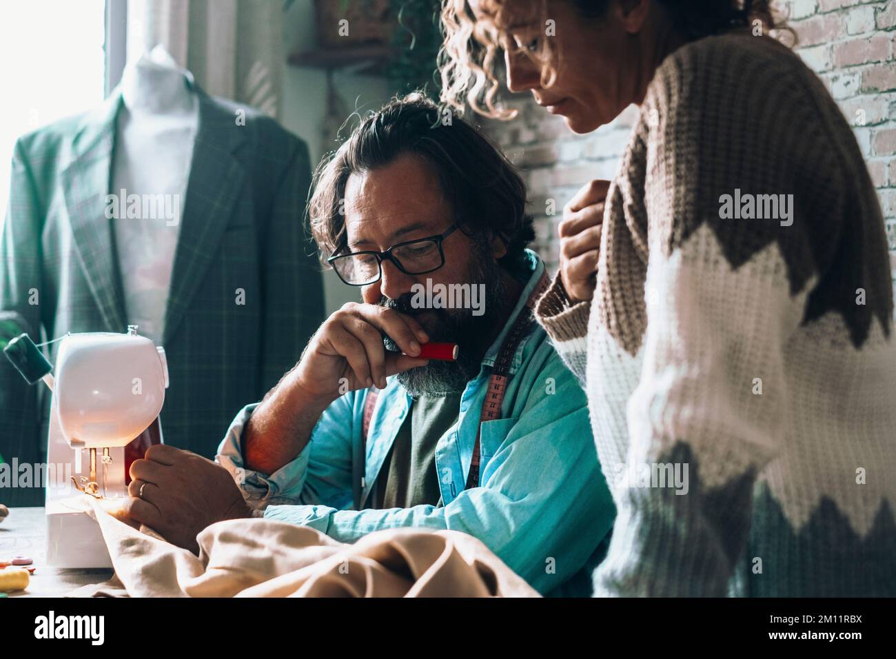 Two suits tailor hi-res stock photography and images - Alamy