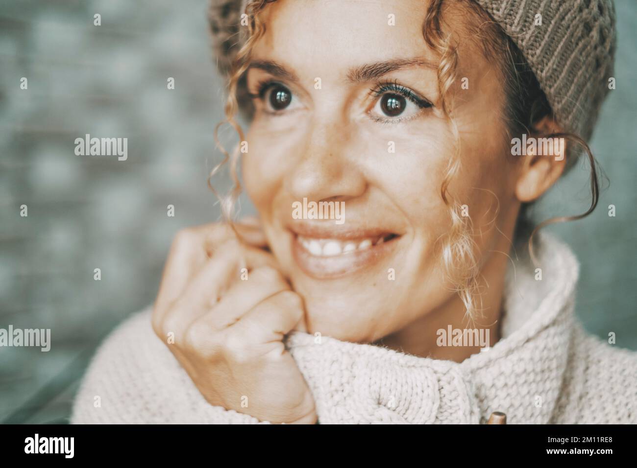 Close up portrait of happy mature woman with dreamer expression on face ...