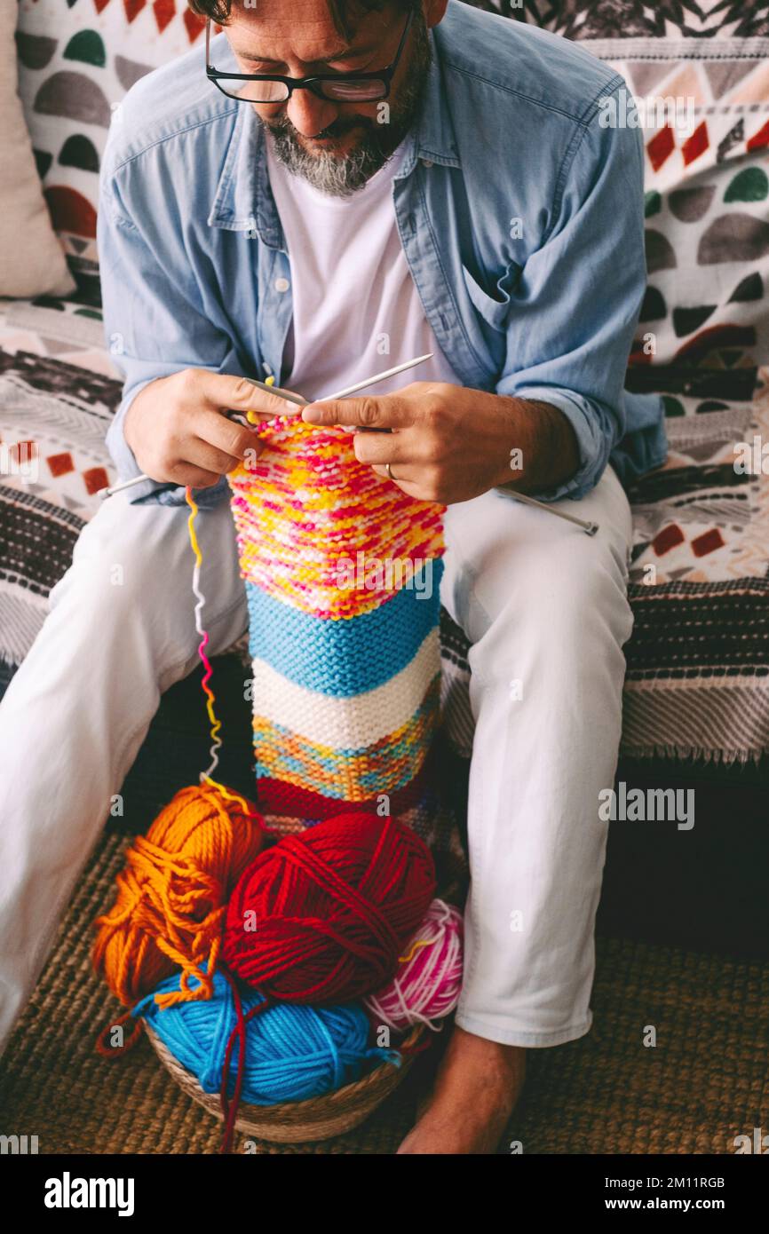 Portrait of man doing female style hobby leisure activity at home busy ...