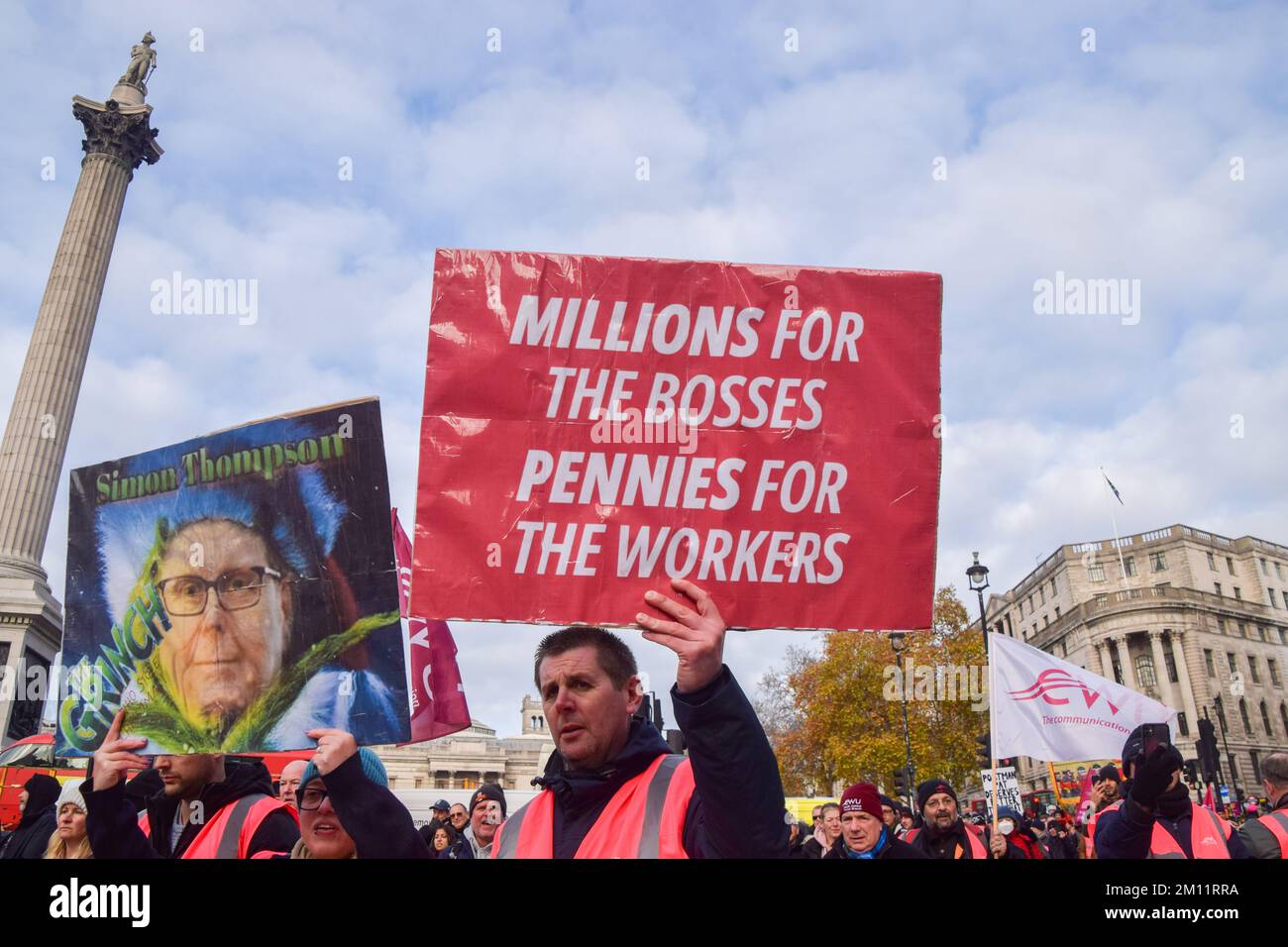 London, UK. 09th Dec, 2022. A protester marches through Trafalgar ...