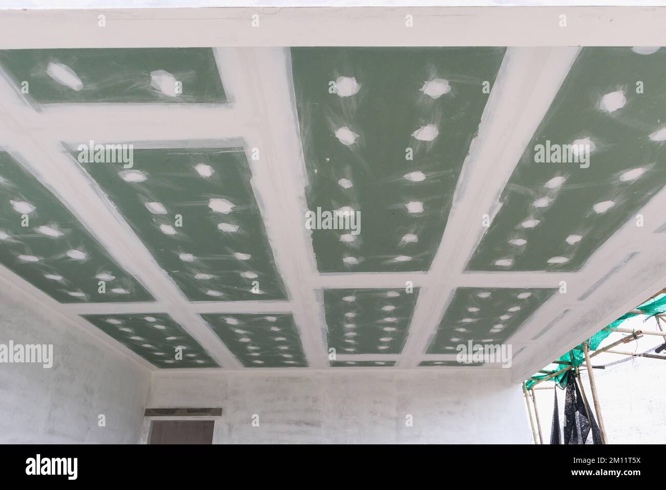 ceiling gypsum board installation at construction site Stock Photo - Alamy
