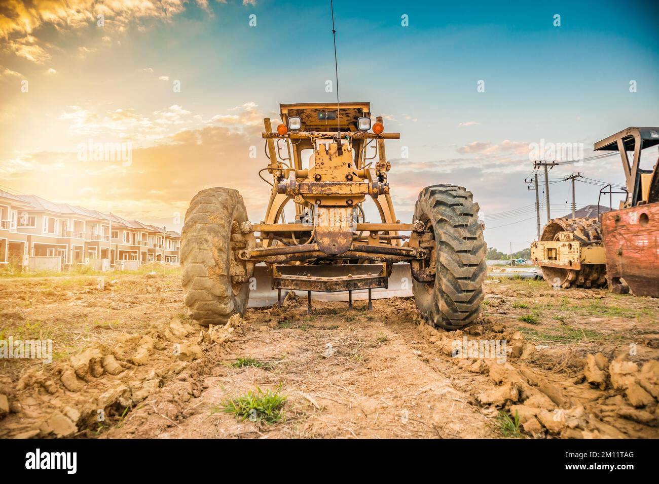 heavy machinery working at construction site Stock Photo - Alamy