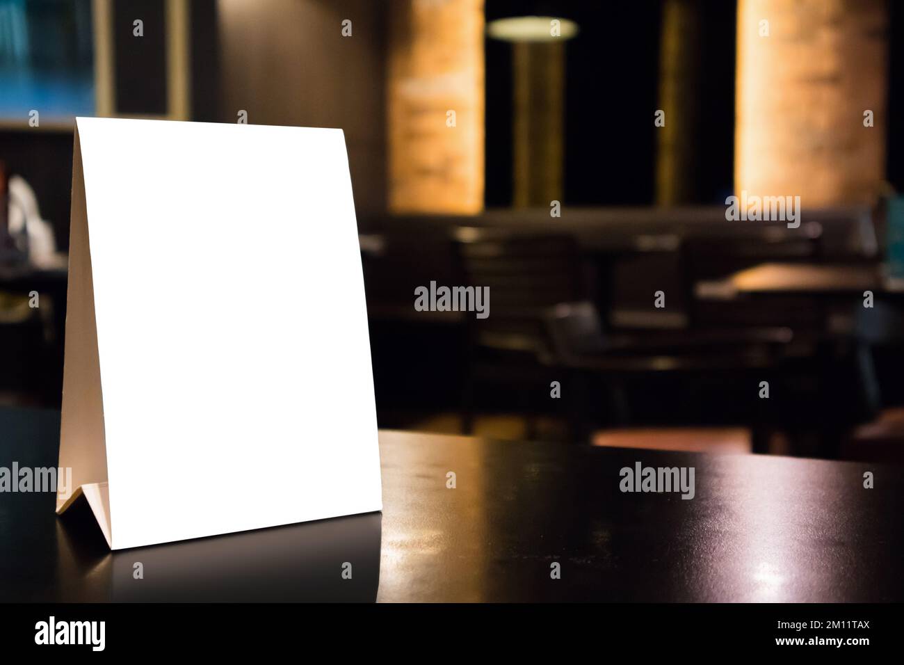 Mockup empty white label menu frame on table with cafe restaurant ...