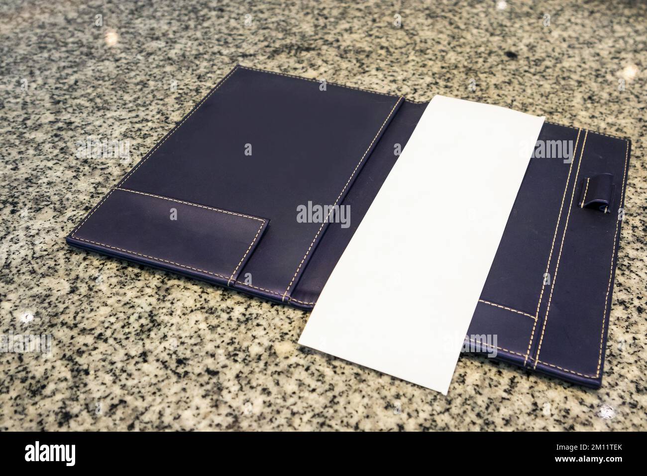Blank empty white paper in restaurant payment billing receipt folder on ...