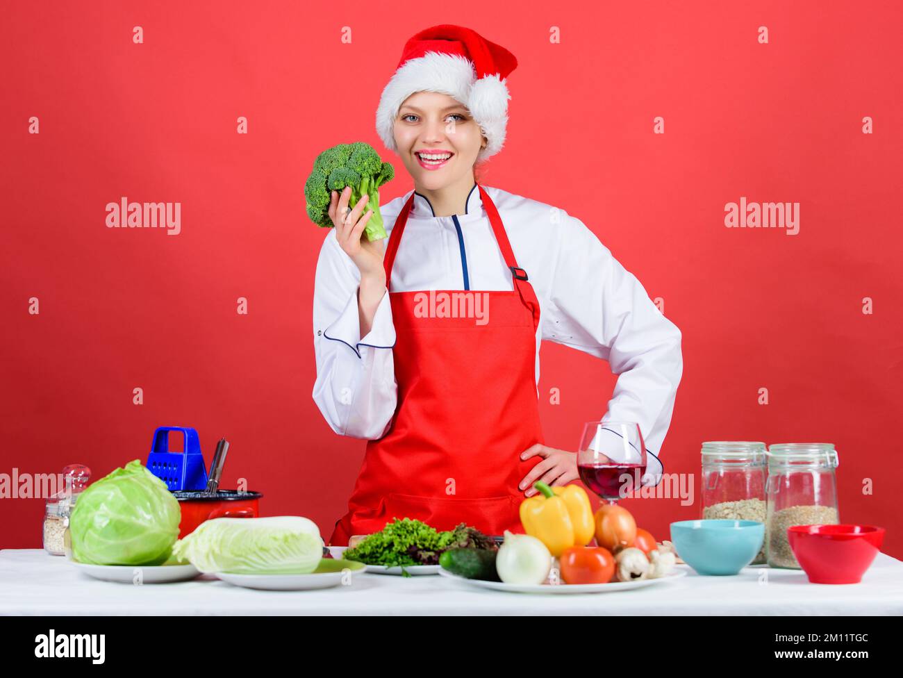 Woman chef cooking christmas dinner wear santa hat. Festive menu ...