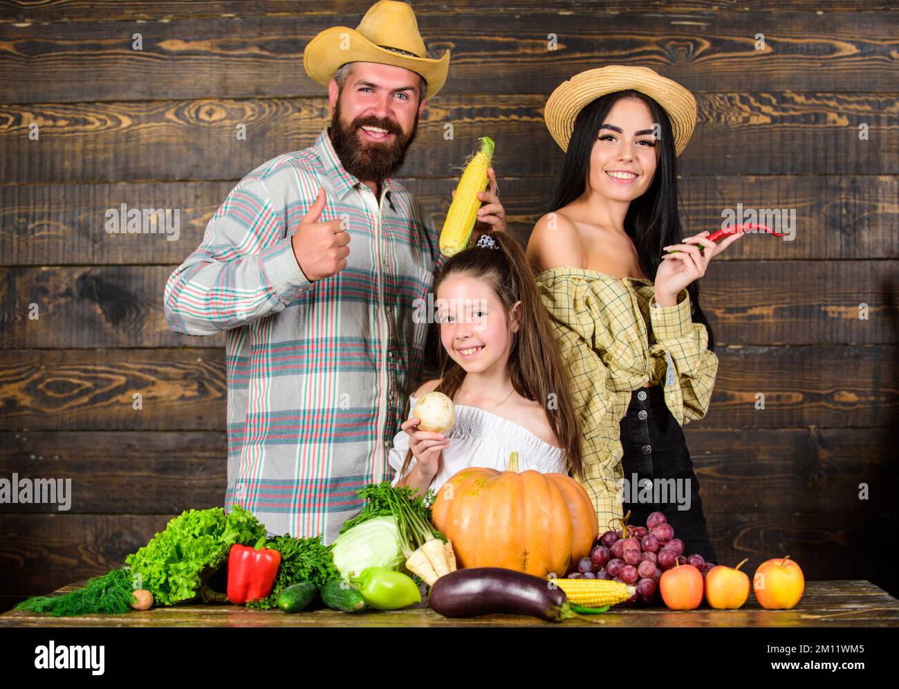 Family rustic style farmers at market with vegetables fruits and ...