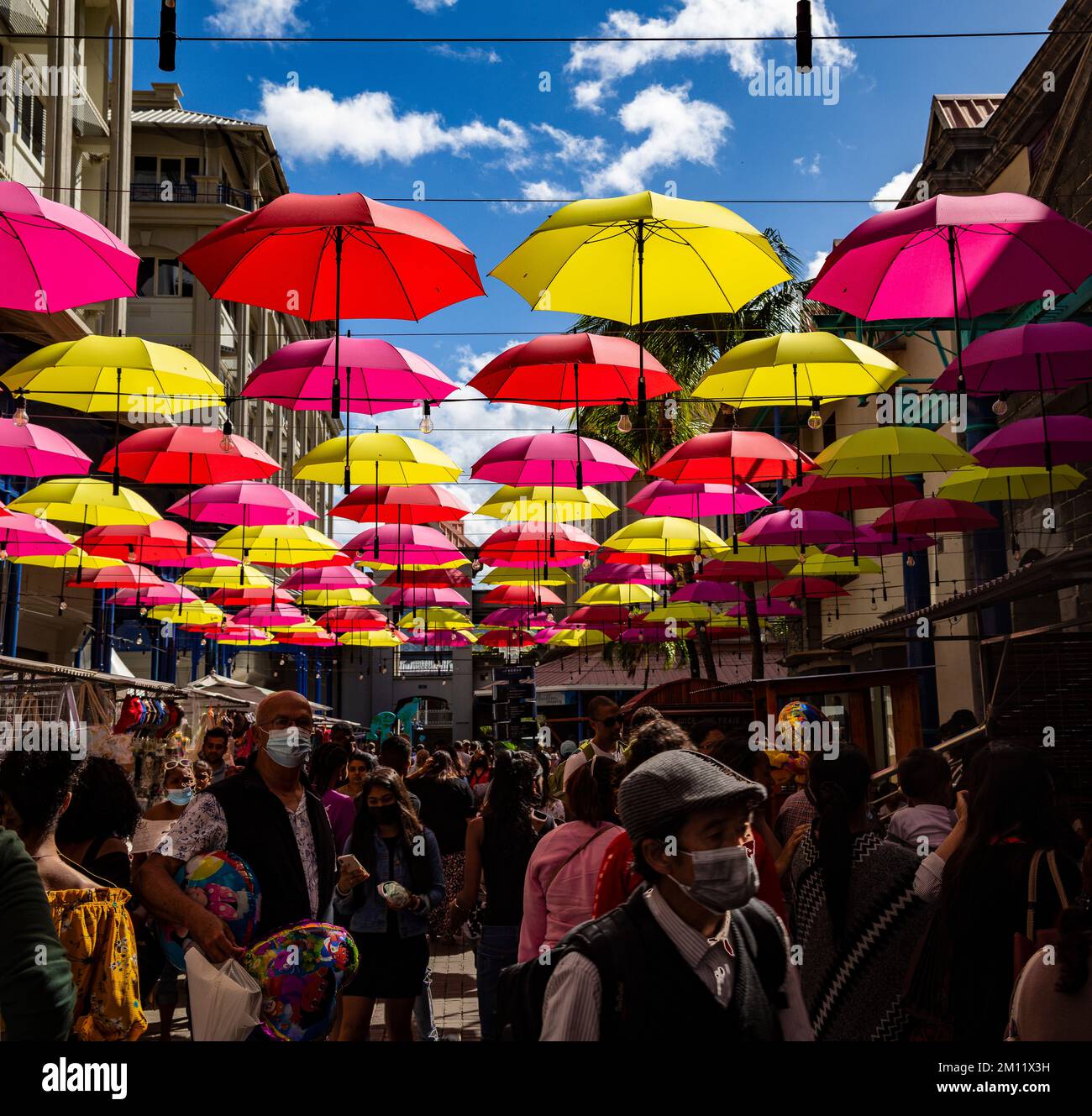Umbrellas lining caudan waterfront commercial development in port louis ...