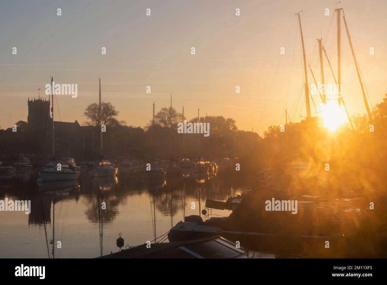 England, Dorset, Christchurch, Town Skyline and River Stour at Dawn ...