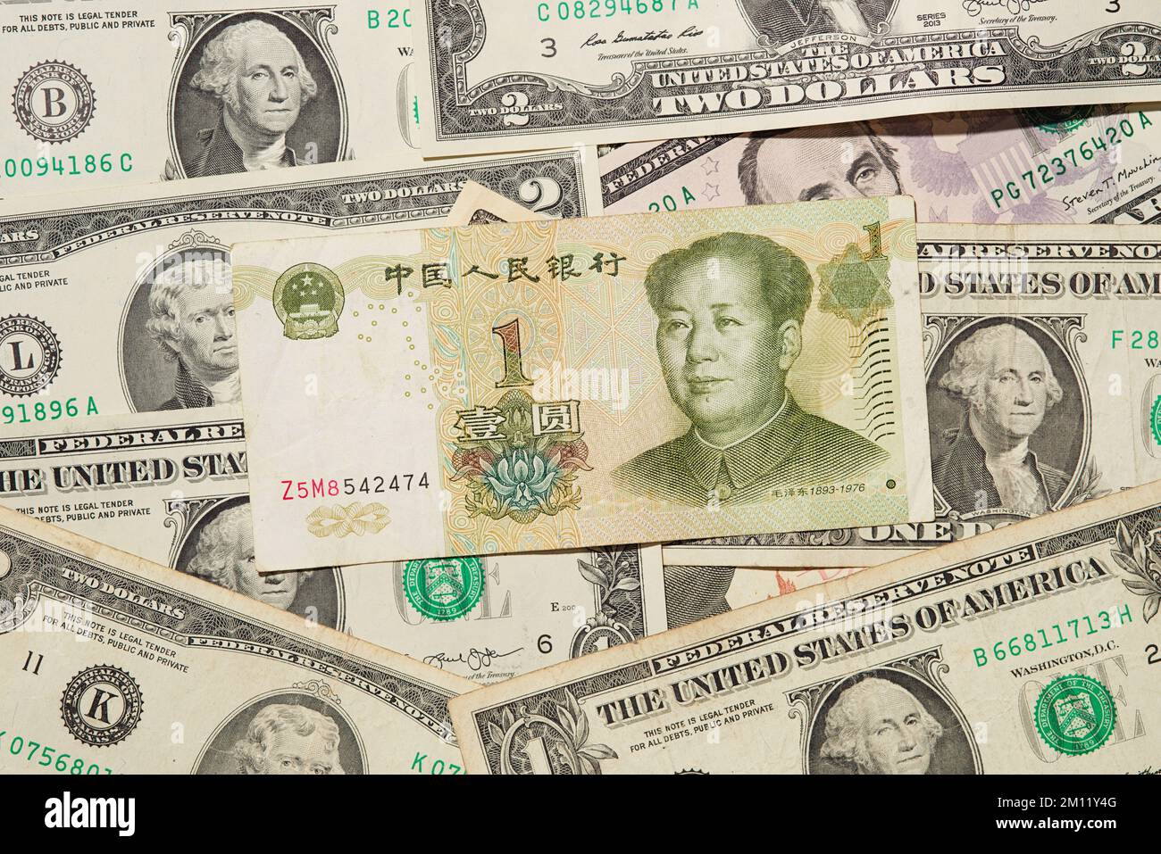 One Chinese yuan bank note on USA dollars background Stock Photo - Alamy