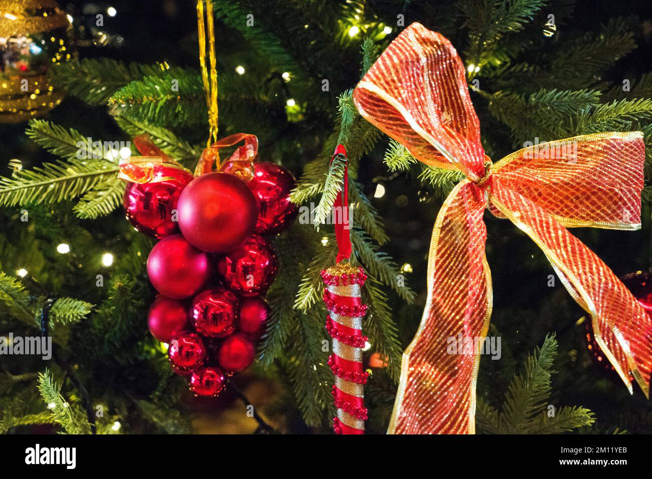 Close up of Christmas tree with ornaments of baubles, snowflakes, teddy ...