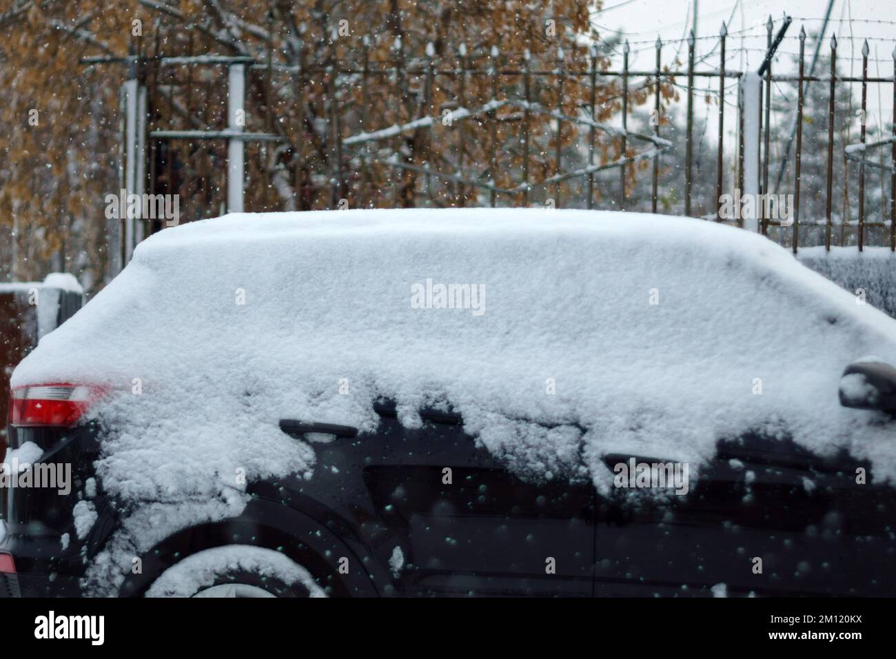 Car is under the snow. Vehicles covered with snow during a winter ...