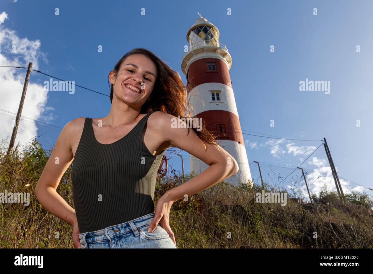 Young female model at Pointe aux Caves also known as Albion lighthouse ...
