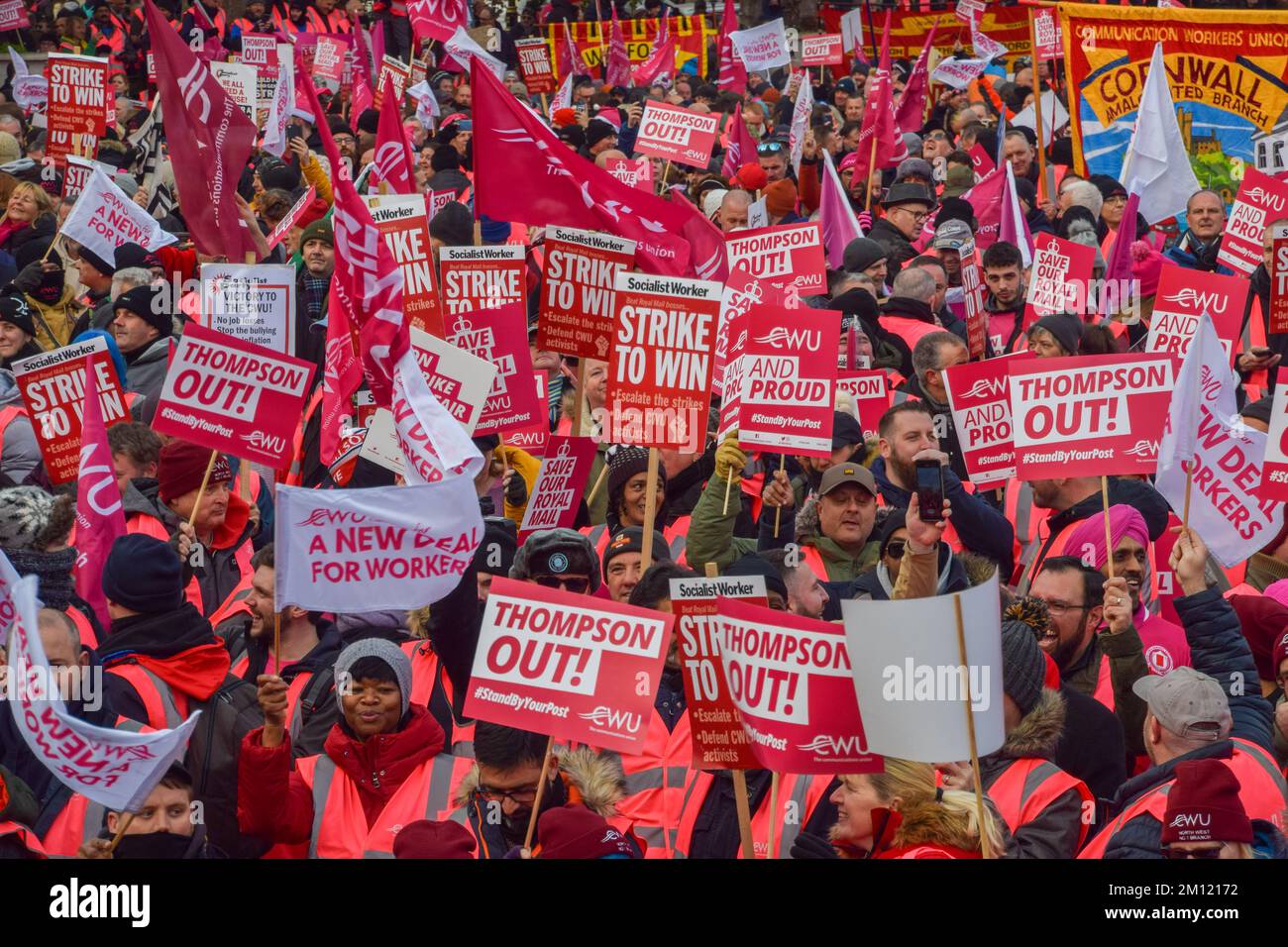 Protesters hold placards in support of strikes during the demonstration ...