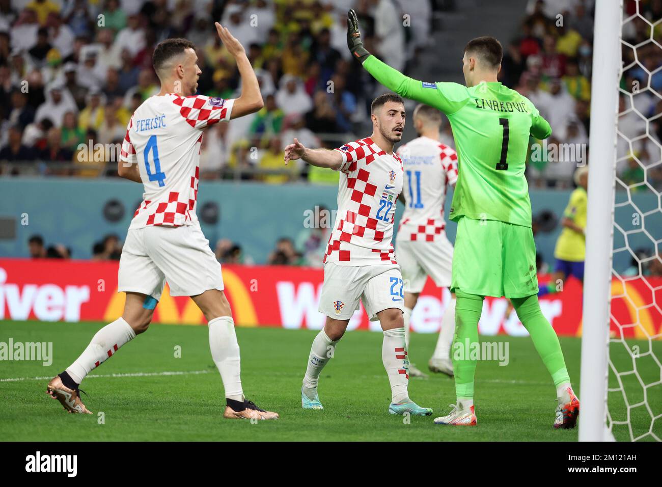 AL RAYYAN, QATAR - DECEMBER 09: Ivan Perisic and Dominik Livakovic of ...