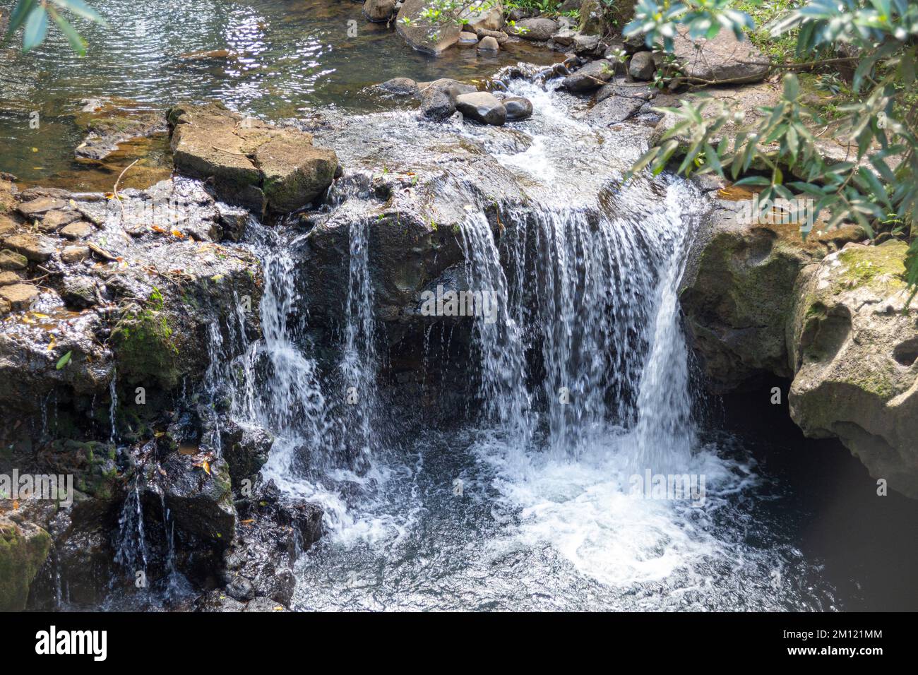 Waterfall in La Vallée Des Couleurs Nature Park Stock Photo - Alamy