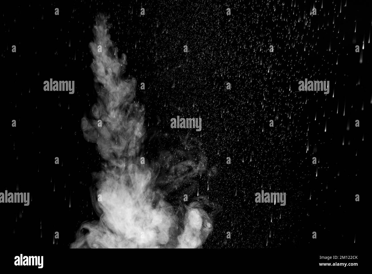 A jet of hot steam with splashes. The movement of hot steam with water ...