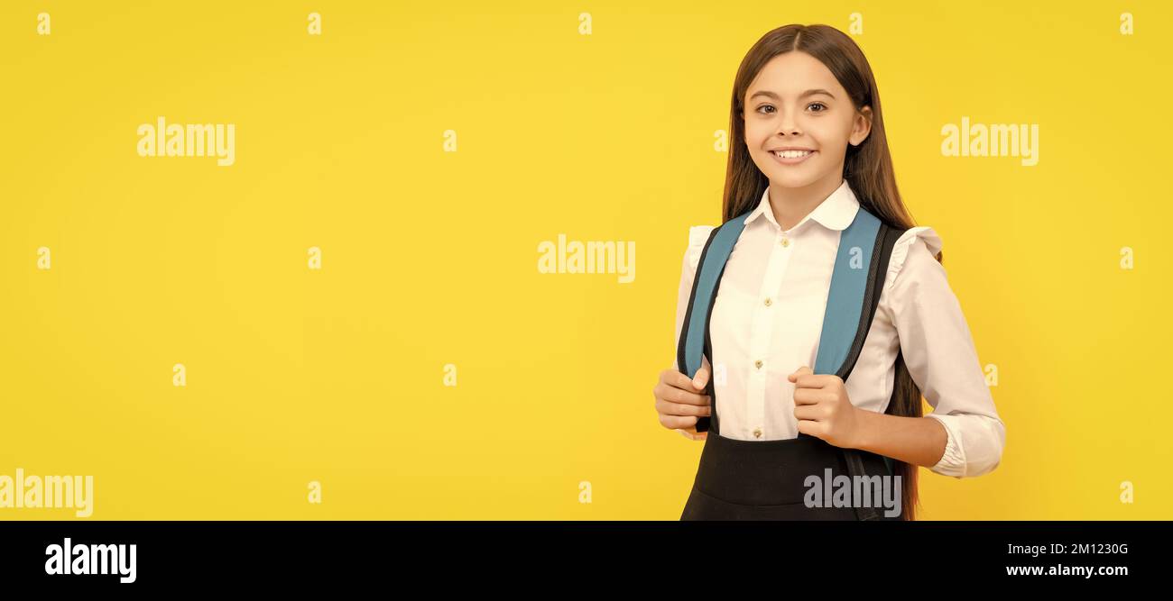 happy kid in school uniform carry backpack, copy space, back to school ...