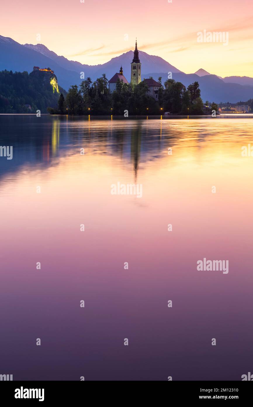 View of lake Bled at in spring with the small island and Assumption of ...