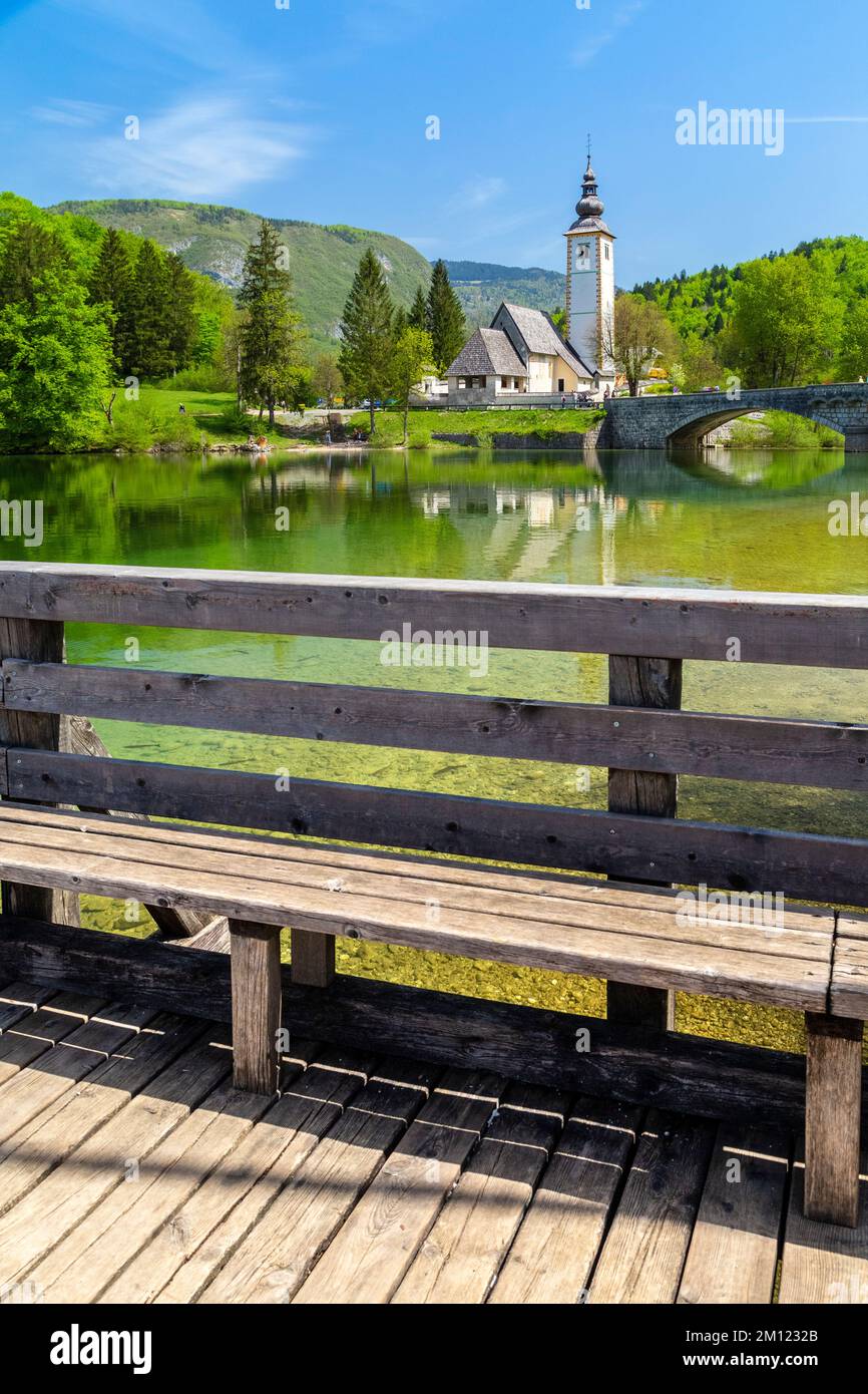 Church of St. John the Baptist and the stone bridge by the Bohinj lake ...