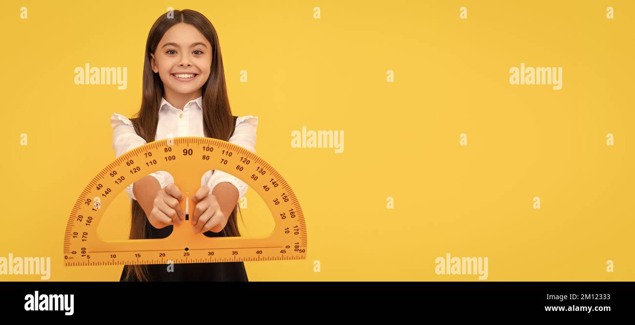 cheerful kid in school uniform hold mathematics protractor for ...