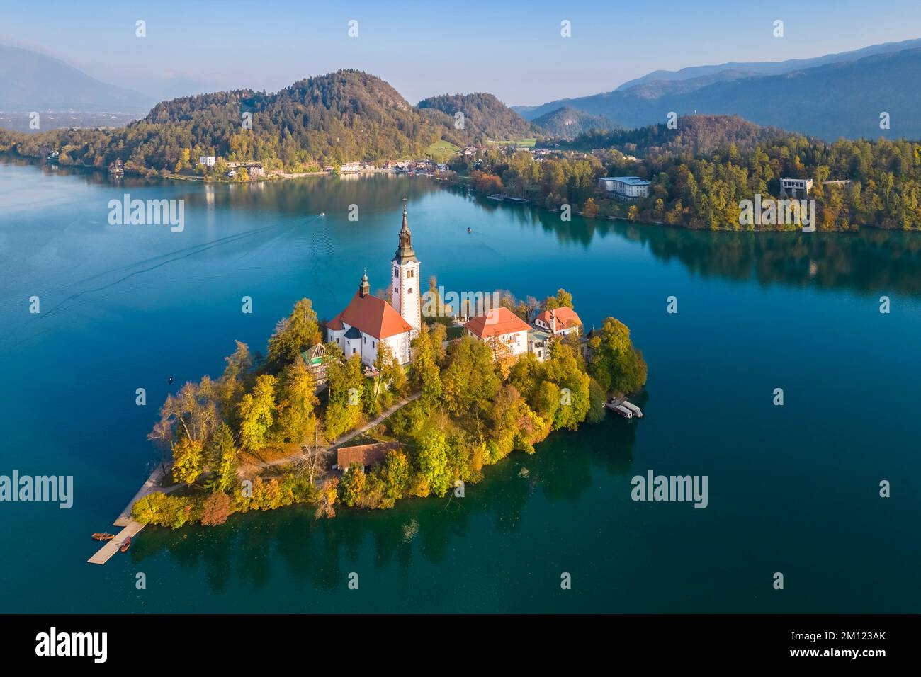 Aerial view of Bled island on Lake Bled in autumn at sunset. Bled ...