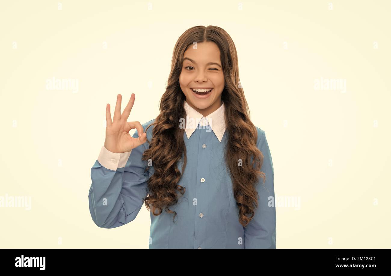 winking child long curly hair isolated on white show ok gesture, beauty ...