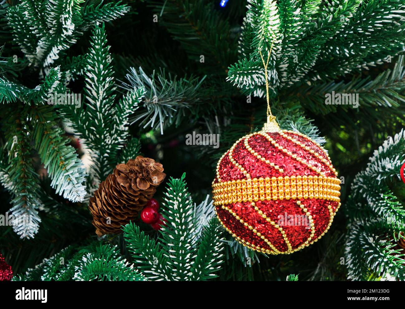 Close up of Christmas tree with ornaments of baubles, snowflakes, teddy ...
