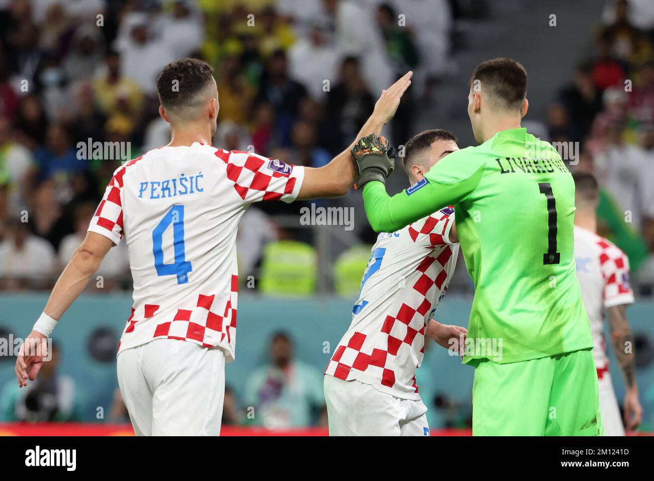 AL RAYYAN, QATAR - DECEMBER 09: Ivan Perisic and Dominik Livakovic of ...