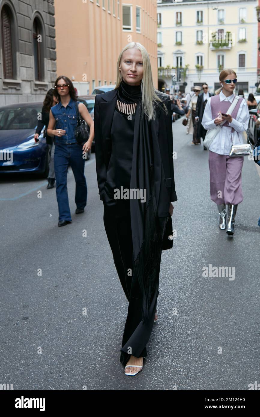 MILAN, ITALY - SEPTEMBER 21, 2022: Woman with black jacket and dress ...