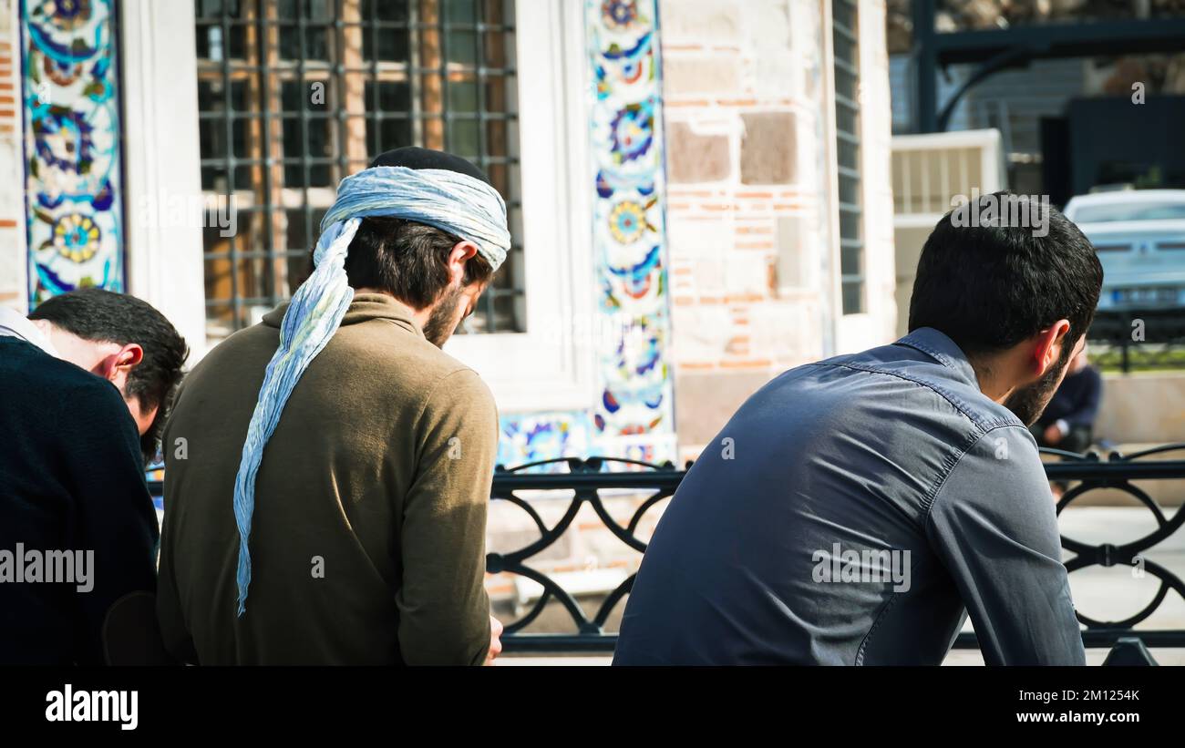 Muslims pray for Friday prayer in the garden of a historical Konak ...