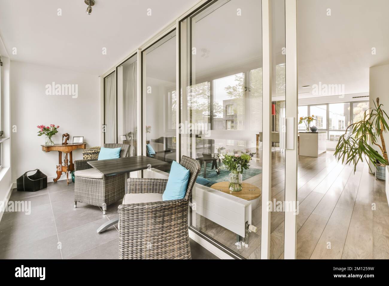 an outdoor living area with patio furniture and large sliding glass ...