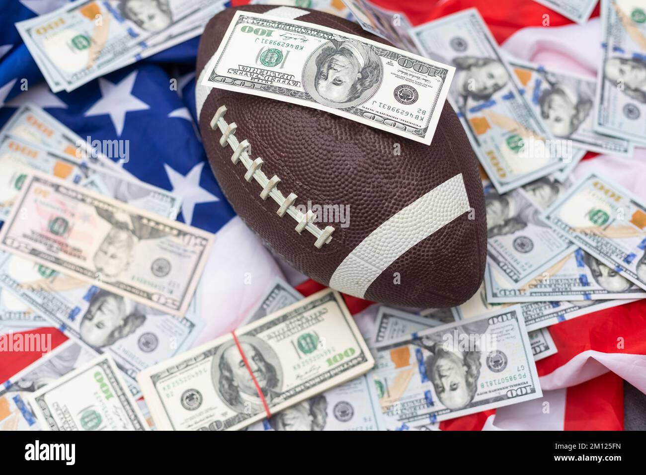 Football ball and money on table Stock Photo - Alamy