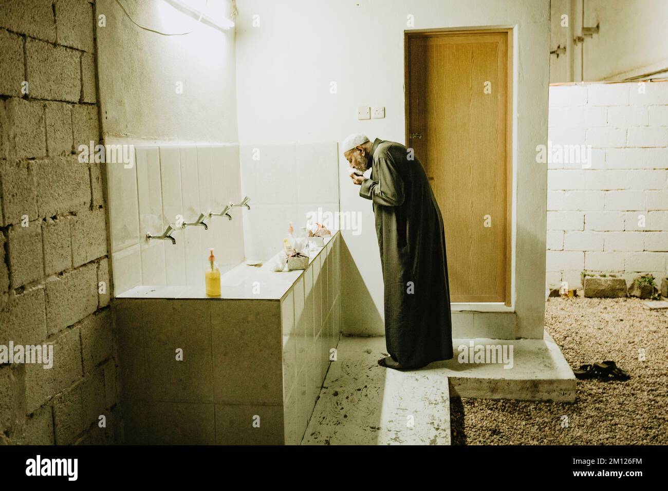 Saudi Arabia, Najran province, Najran, washing place, man Stock Photo ...