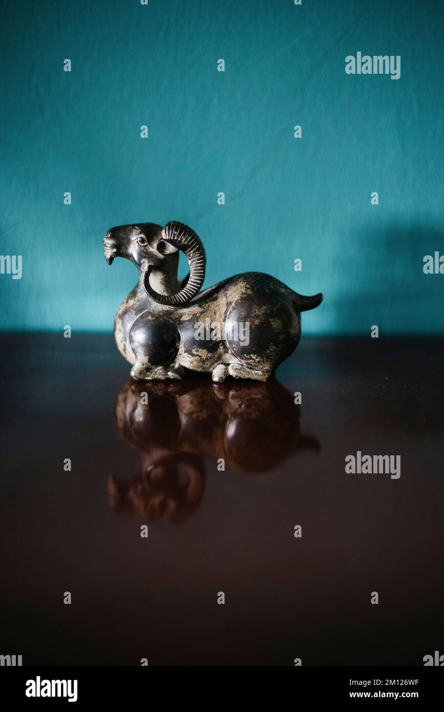 Small metal sculpture in the shape of a ram Stock Photo - Alamy
