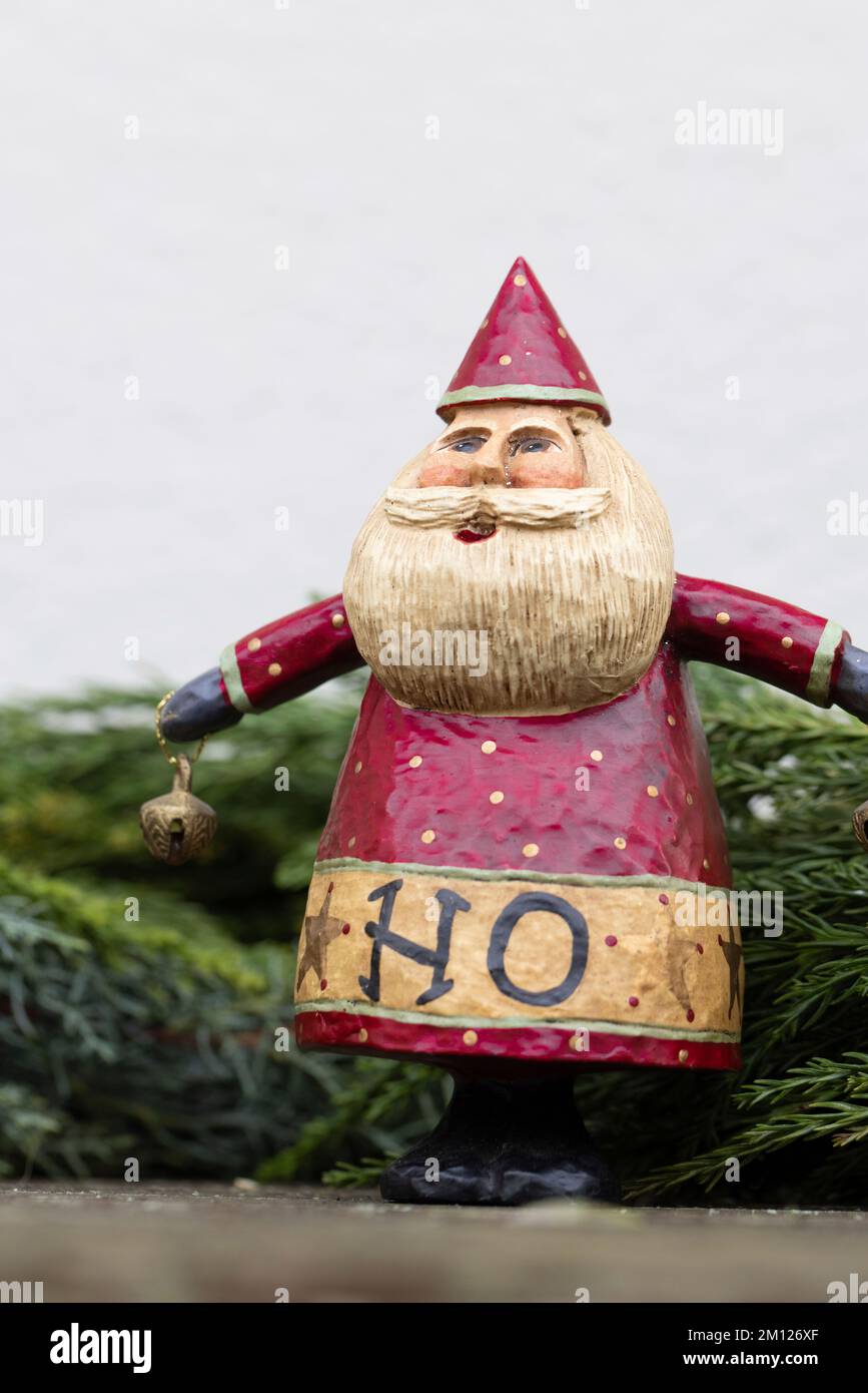 Old fashioned Santa Claus figure in front of fir tree decoration Stock ...