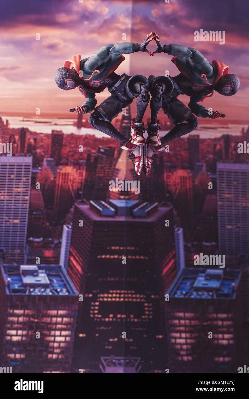 The reflection of Spider-Man Miles Morales in New York Stock Photo - Alamy