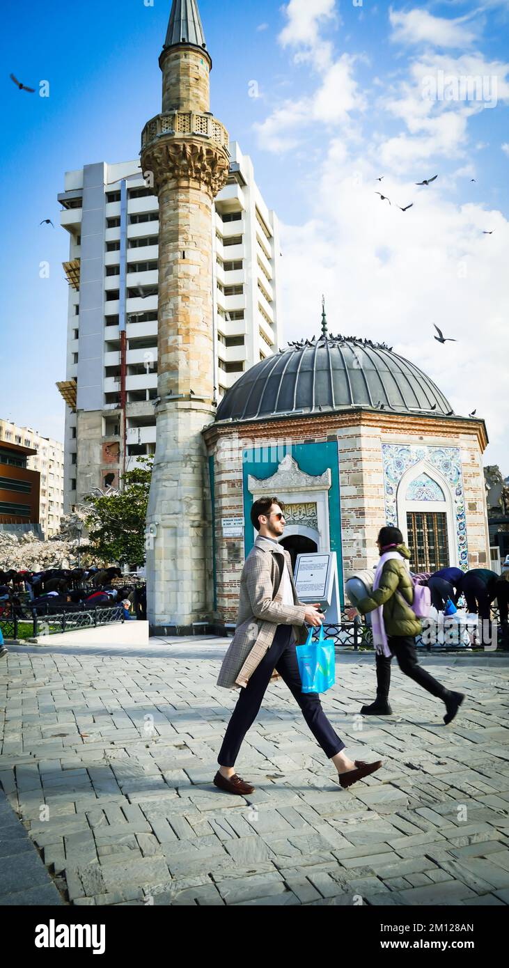 Muslims pray for Friday prayer in the garden of a historical Konak ...