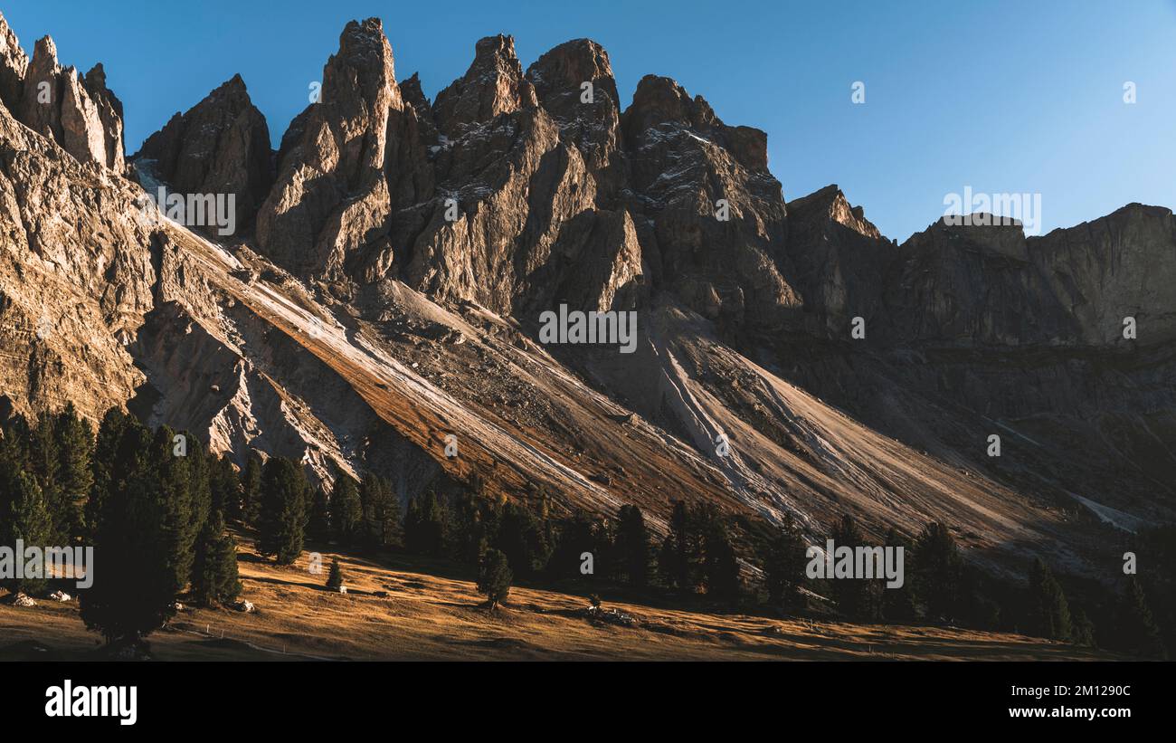 Geisler peaks with autumn forest Stock Photo - Alamy