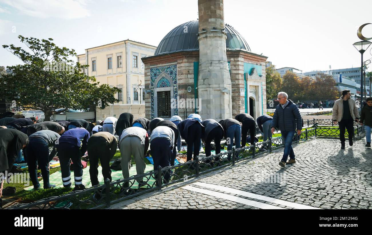 Muslims pray for Friday prayer in the garden of a historical Konak ...