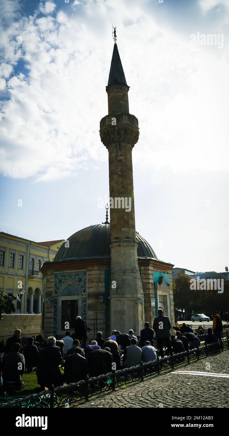 Muslims pray for Friday prayer in the garden of a historical Konak ...