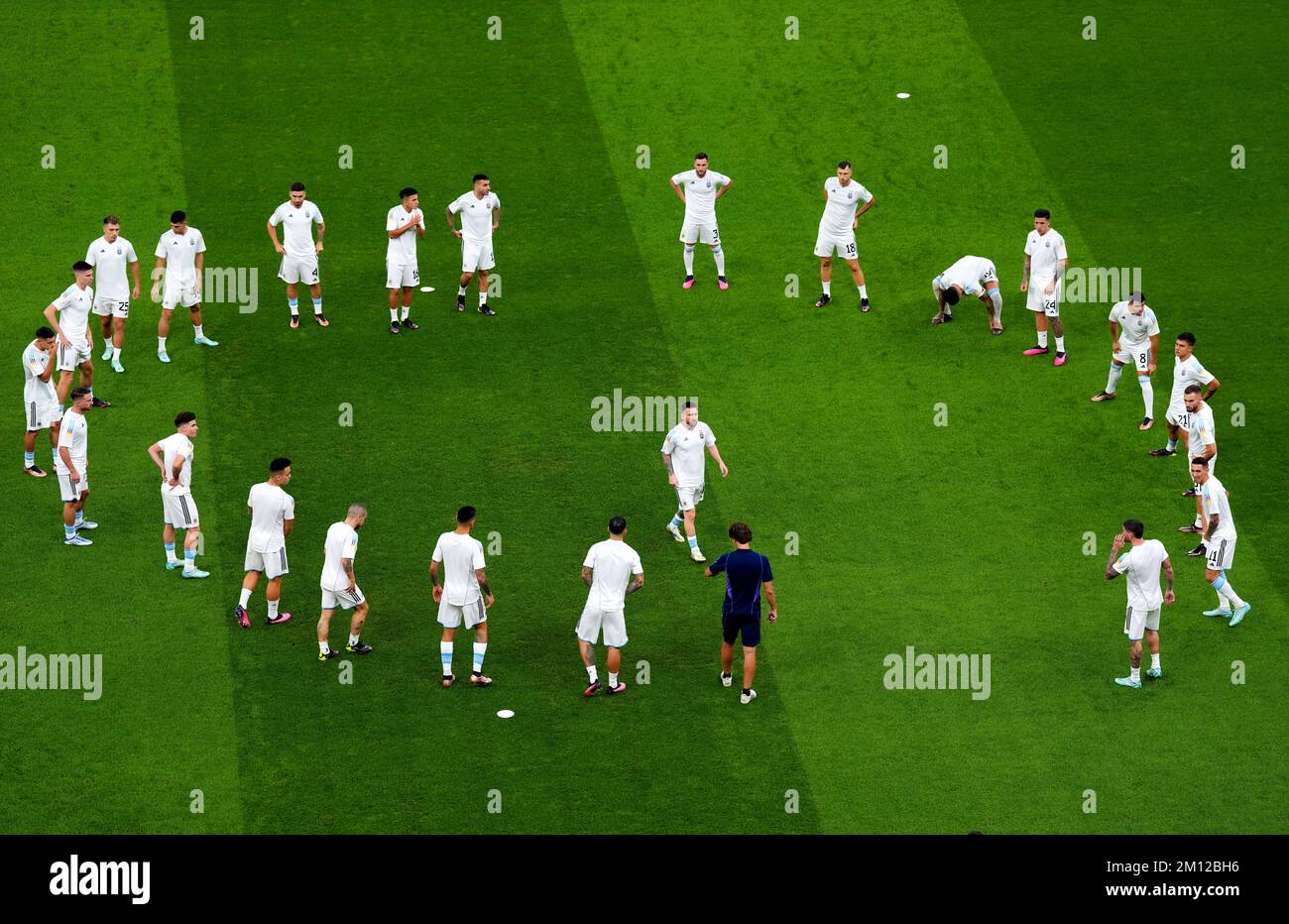 Argentina's Lionel Messi (centre) walks across the pitch as his team ...