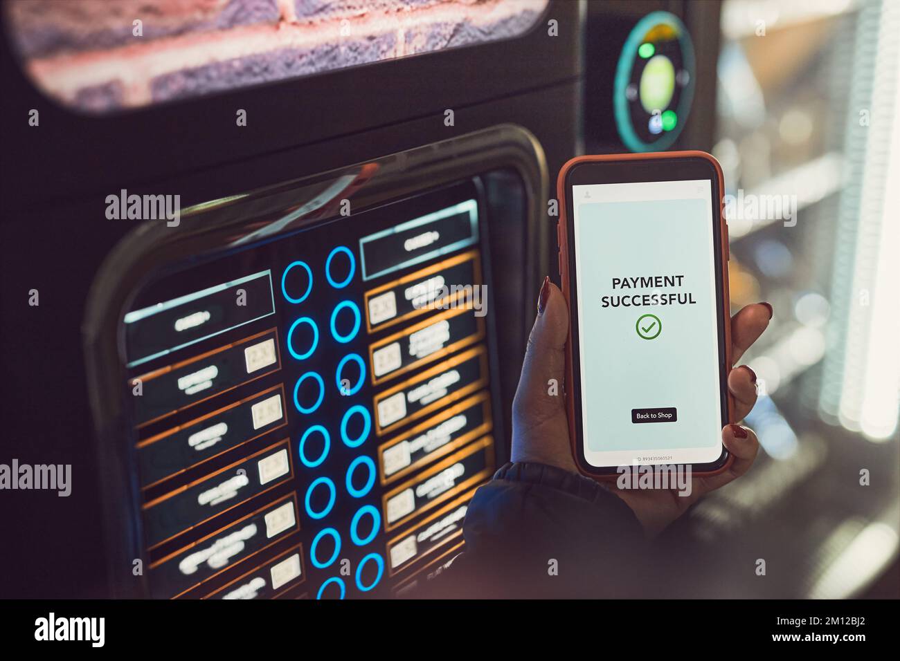 Consumer paying for product at vending machine using contactless method ...
