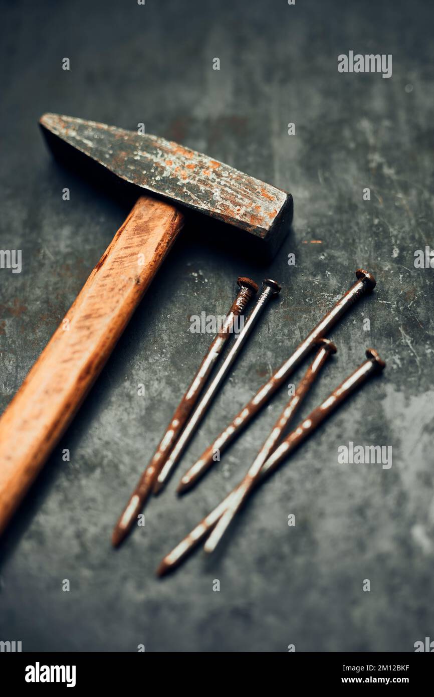 Hammer and nails on steel surface. Tools for maintenance. Hardware ...